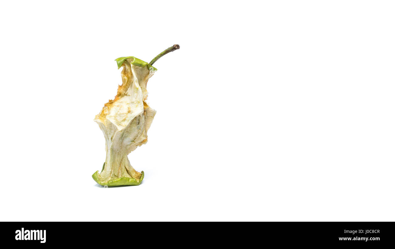 Dried green apple core in front of white background Stock Photo - Alamy