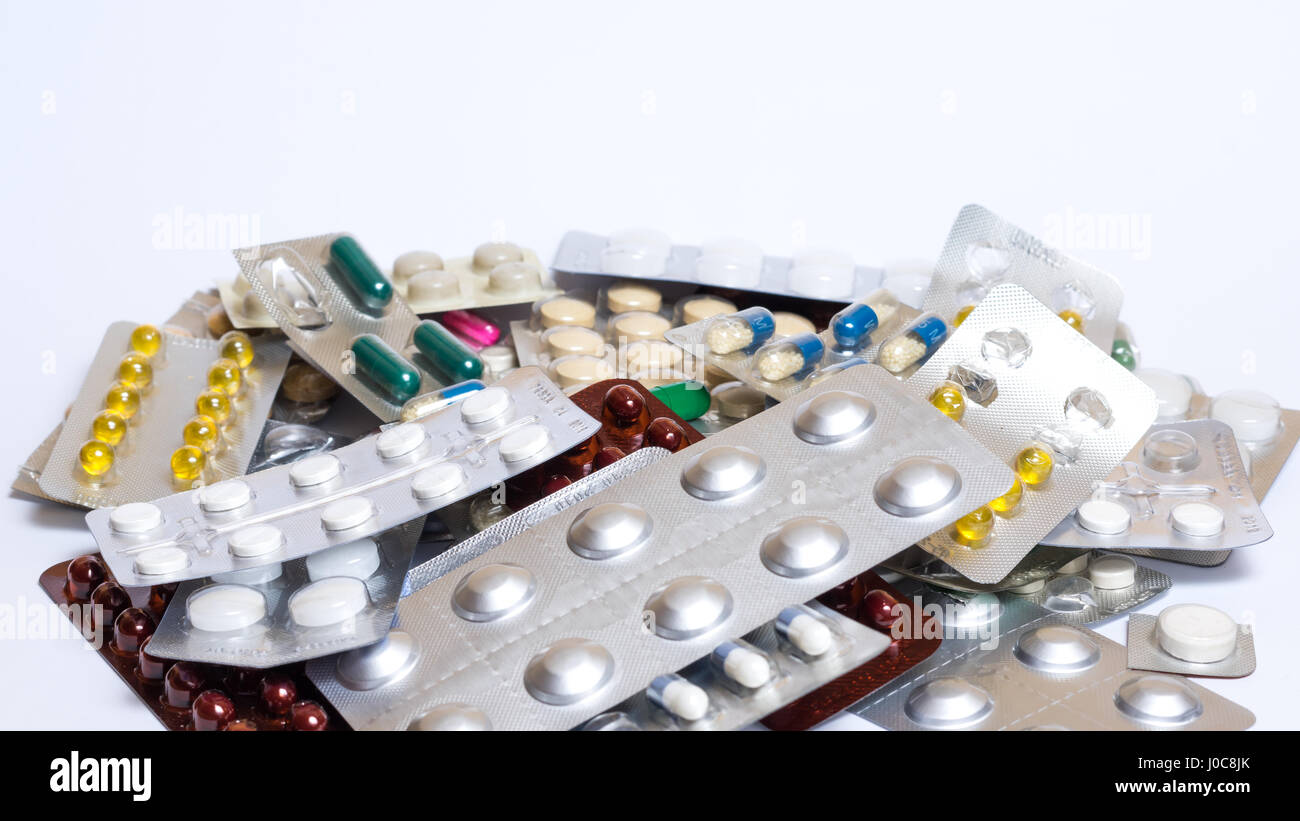Big pile of drugs in front of white background Stock Photo - Alamy