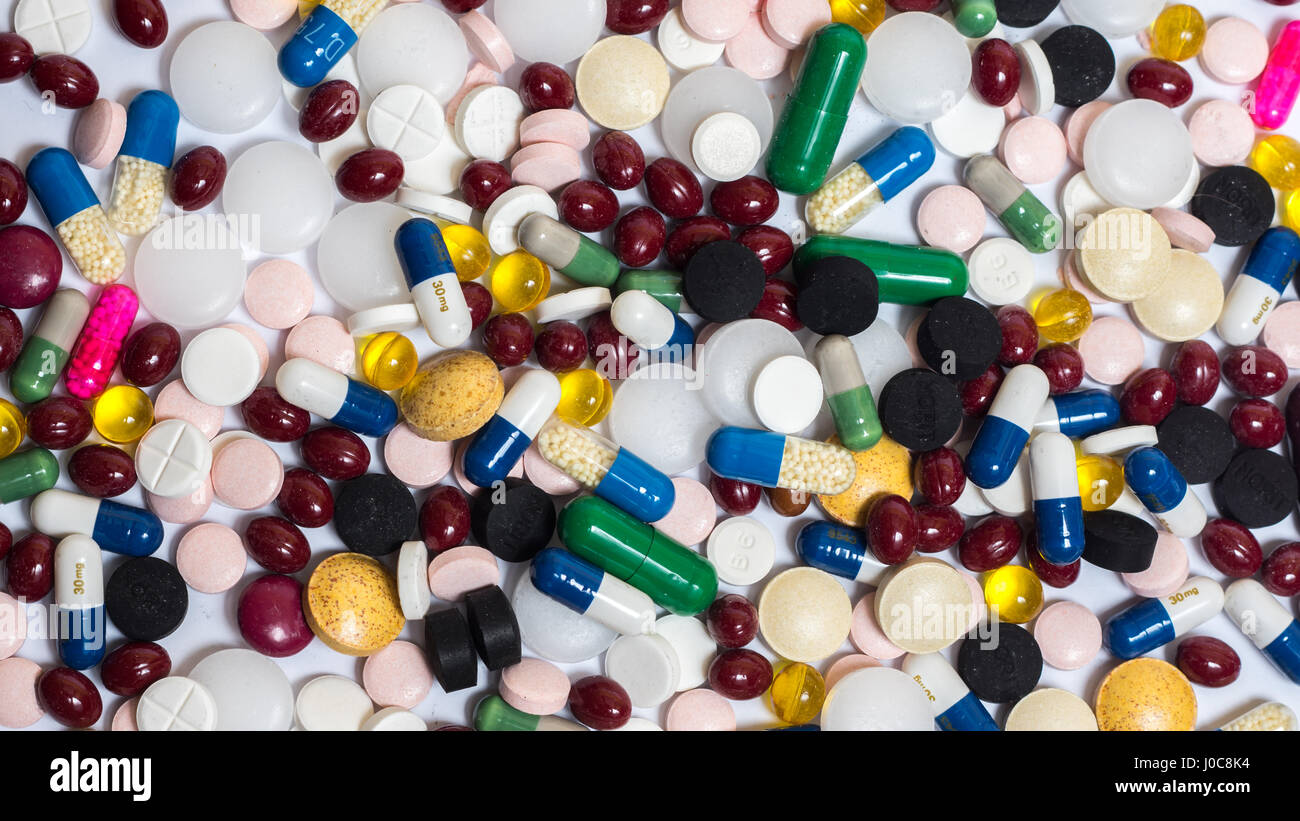 Big pile of drugs in front of white background Stock Photo - Alamy