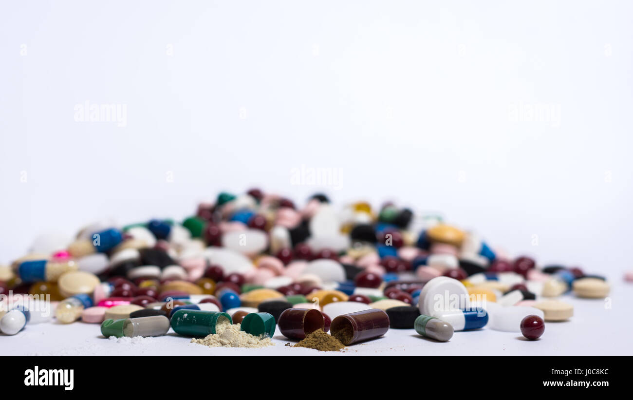 Big pile of drugs in front of white background Stock Photo - Alamy