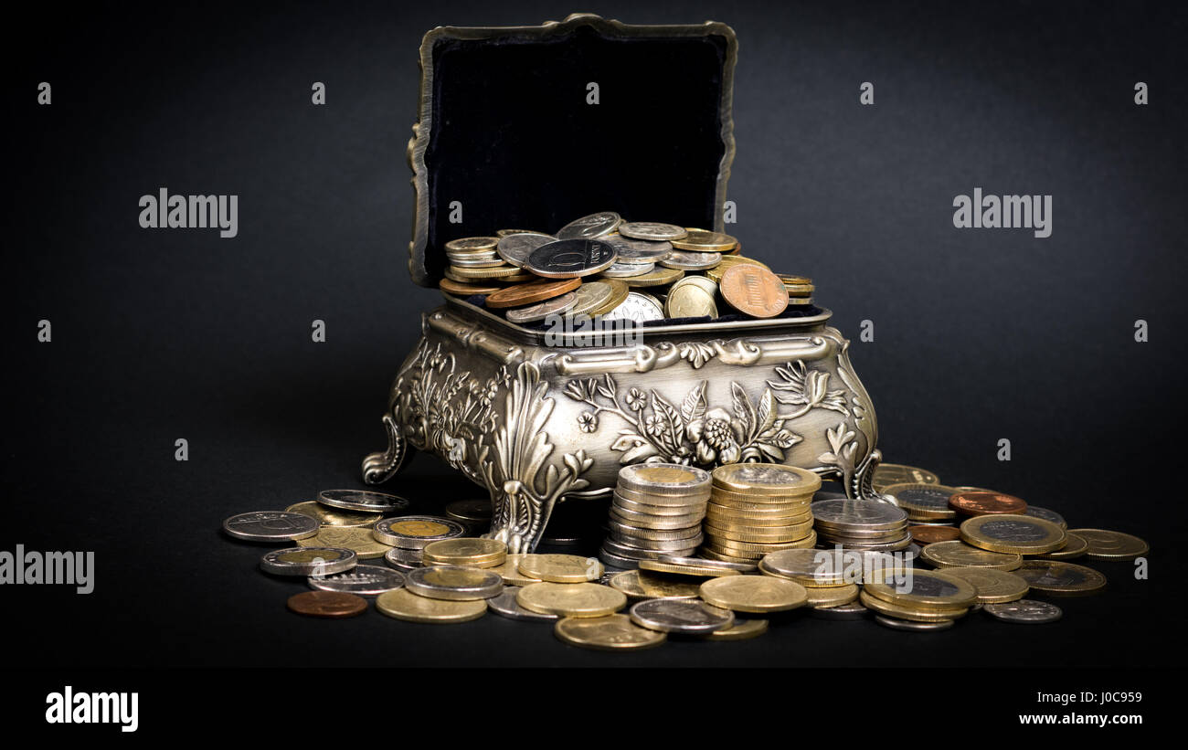 Little metal chest filled up with coins bringing good fortune Stock ...