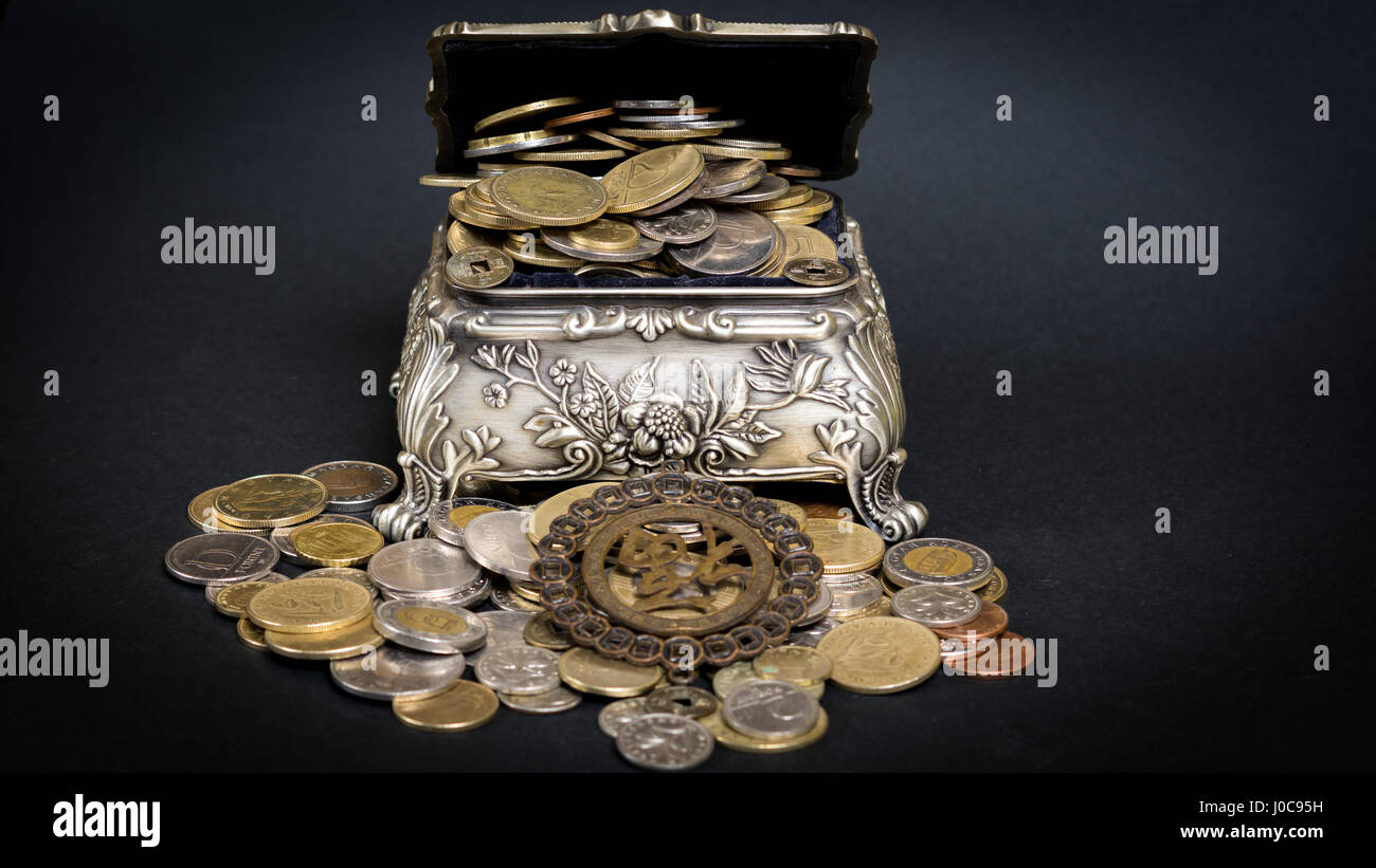 Little metal chest filled up with coins bringing good fortune Stock ...