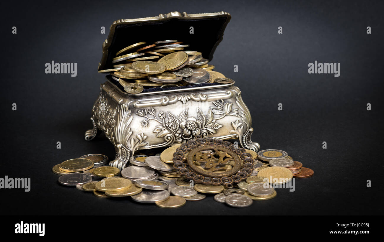 Little metal chest filled up with coins bringing good fortune Stock ...