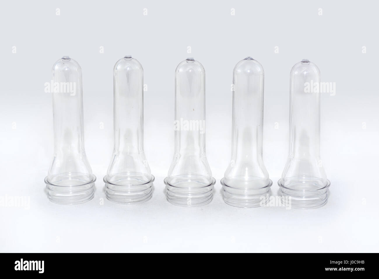 Clear PET Preforms on white background for presentation Stock Photo - Alamy