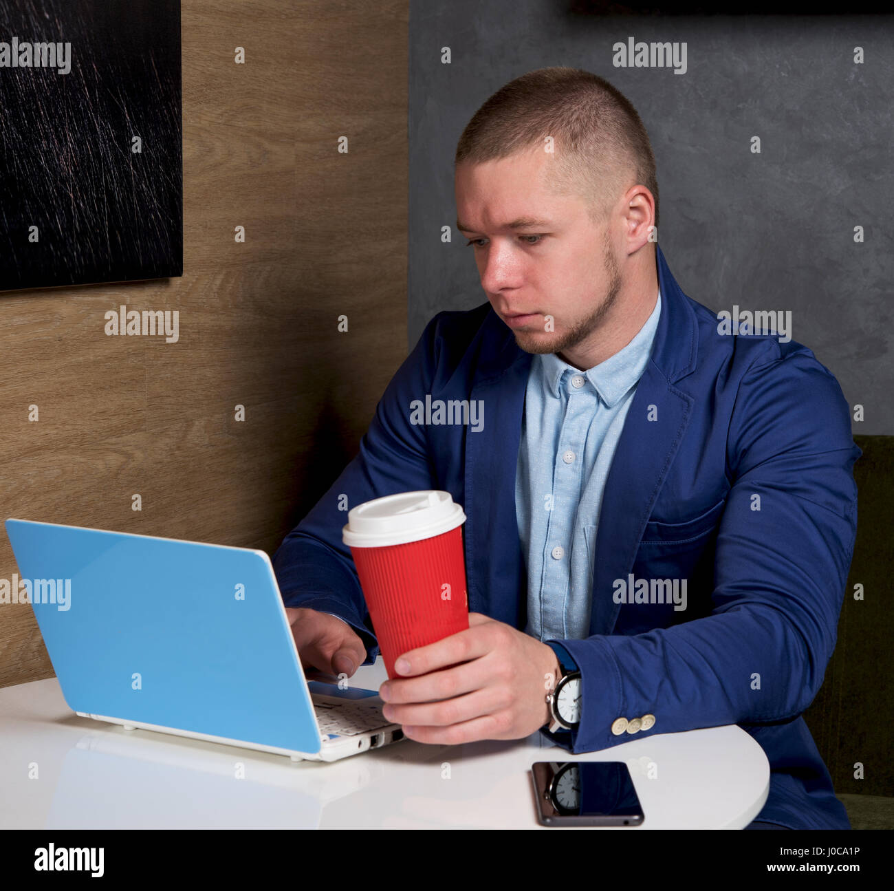 Manager works at a laptop Stock Photo - Alamy