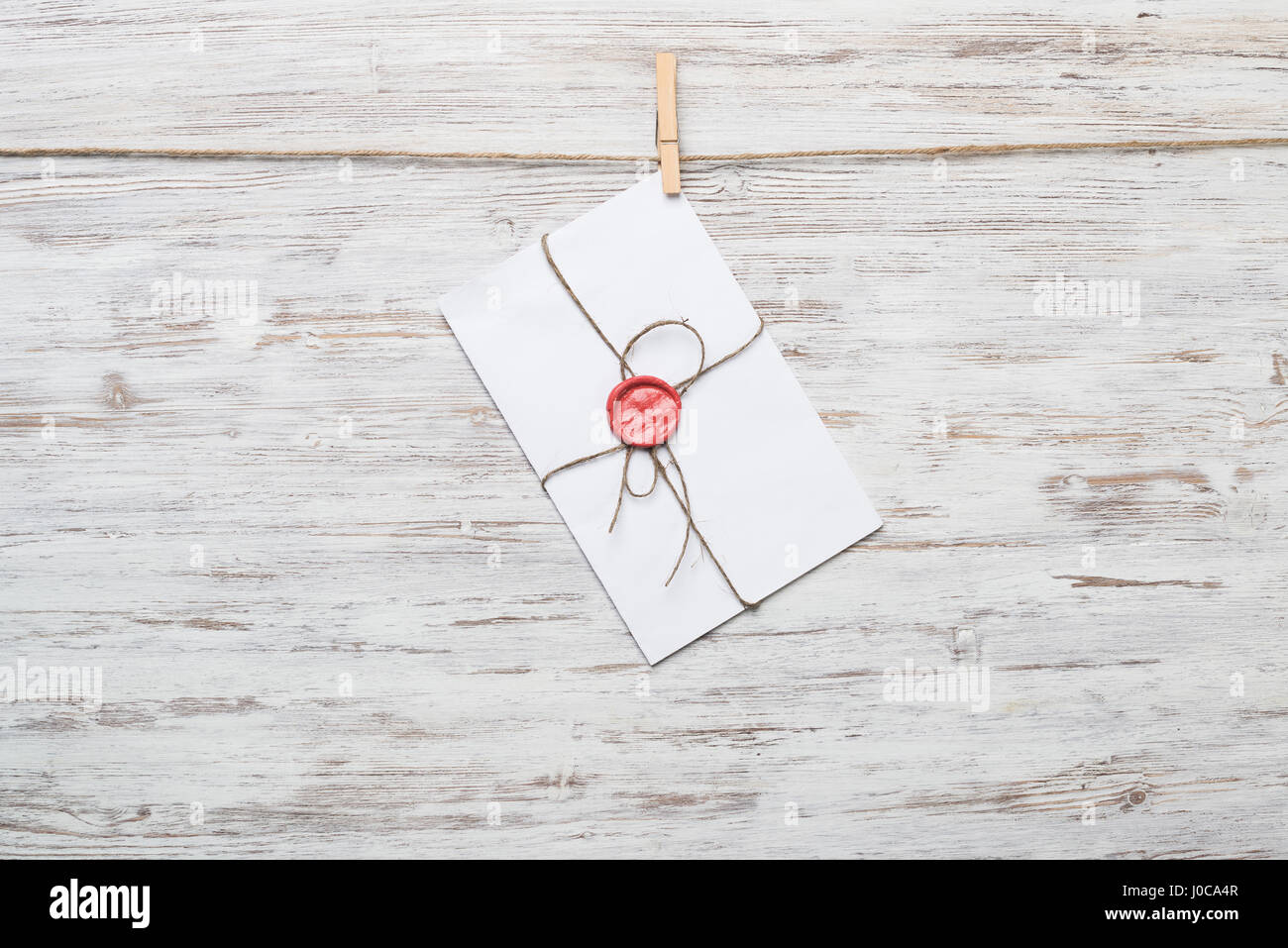Mail envelope on rope Stock Photo - Alamy