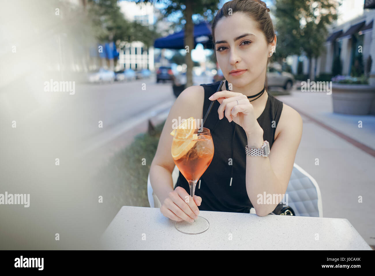 beautiful young girl enjoying a delicious cocktail Stock Photo - Alamy