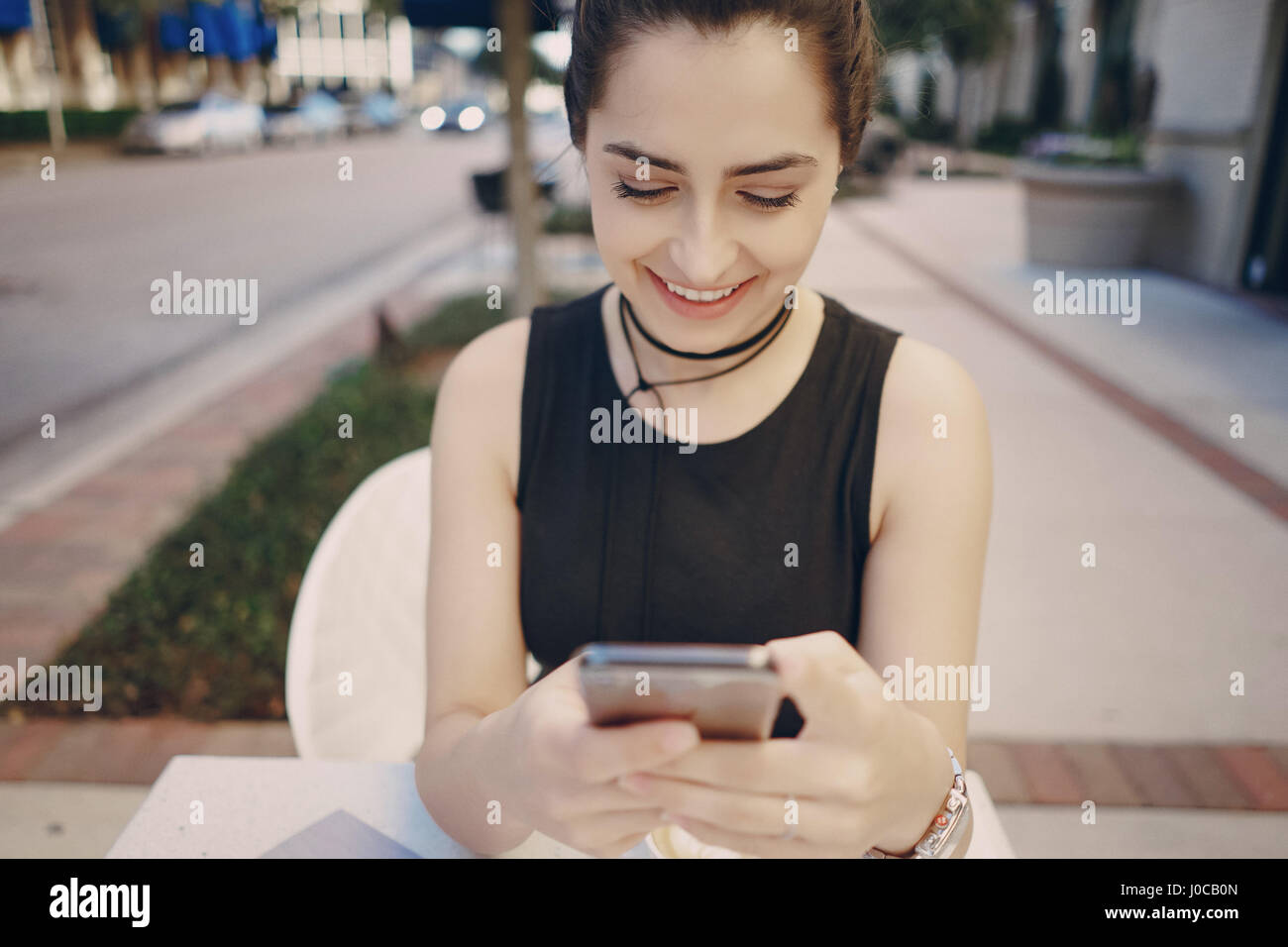 beautiful young girl is typing on phone Stock Photo - Alamy