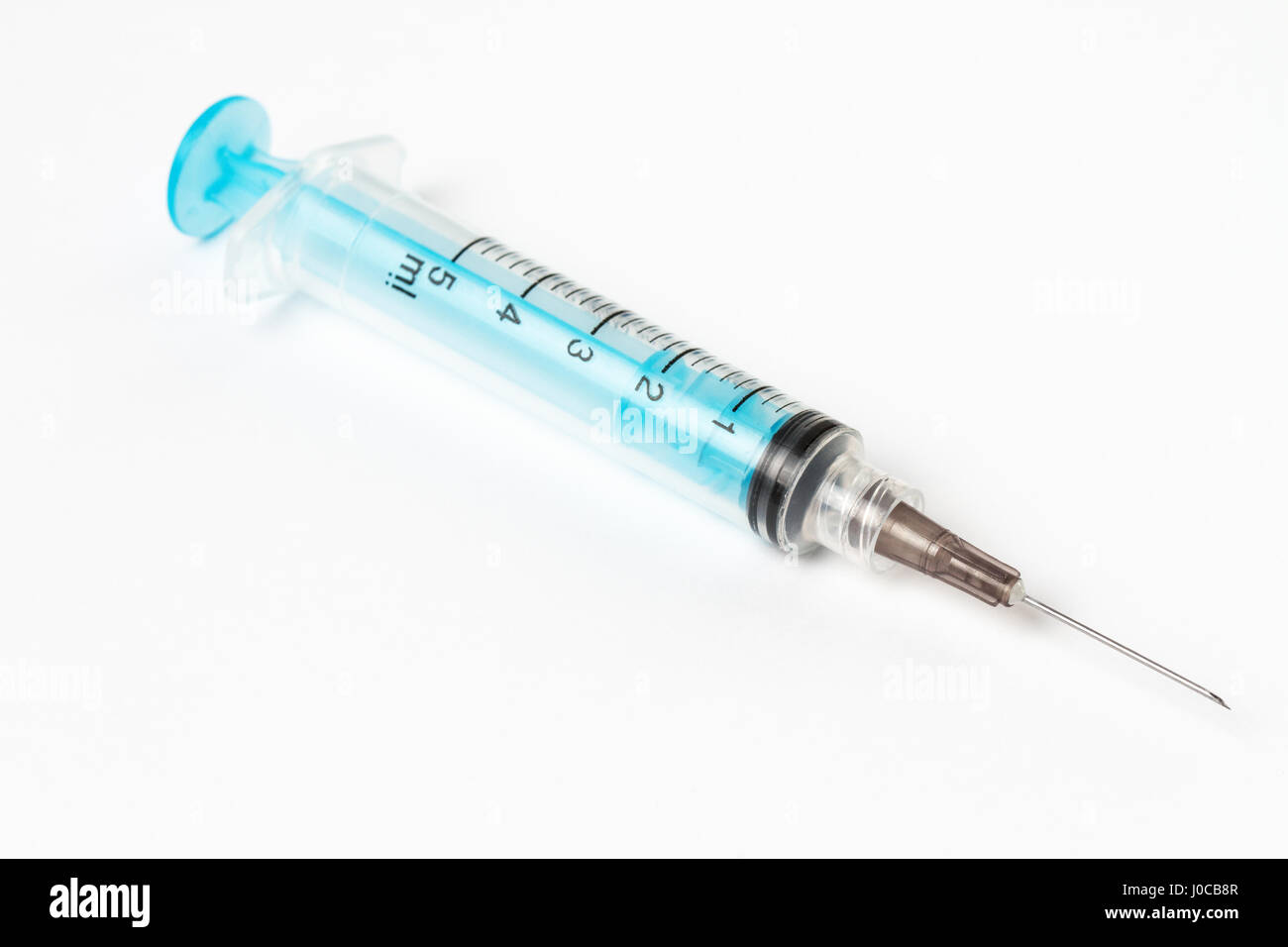 A plastic syringe with blue details Stock Photo - Alamy