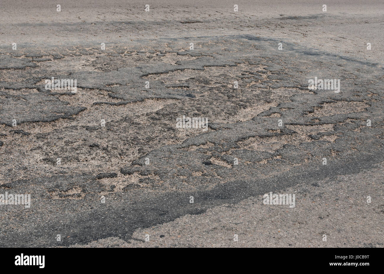 Closeup to Bad Condition of Asphalt Road Stock Photo - Alamy