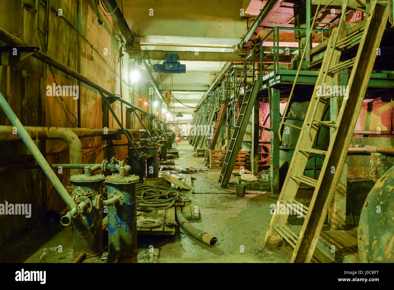 Basement of a water pumping station. Abandoned post-apocalyptic view of ...