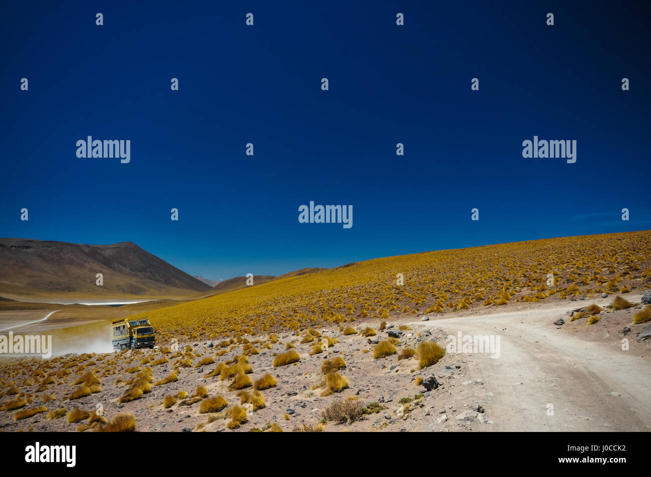 Tourist bus coach truck in the atacama desert Stock Photo - Alamy