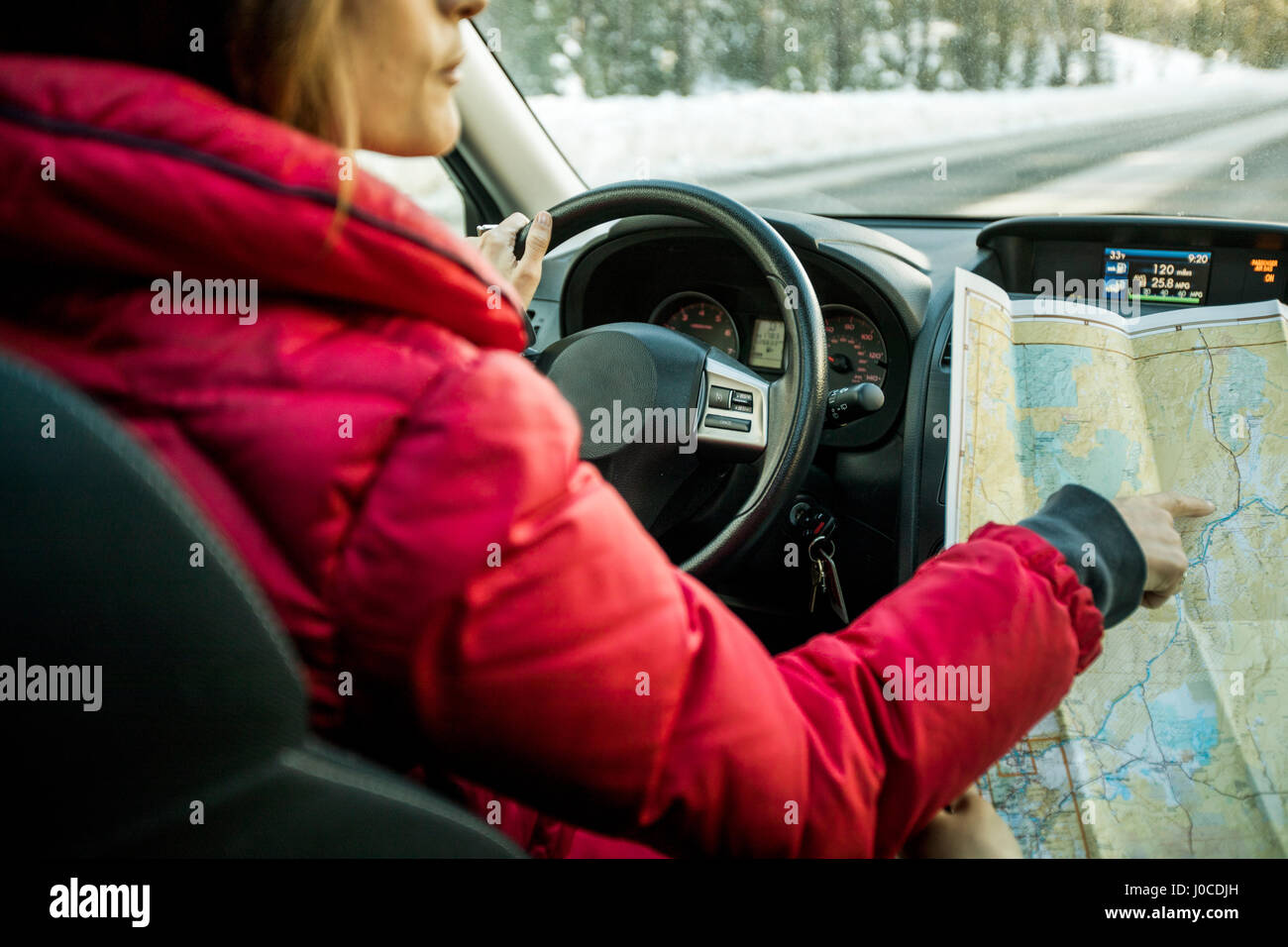 Female pointing at map hi-res stock photography and images - Alamy