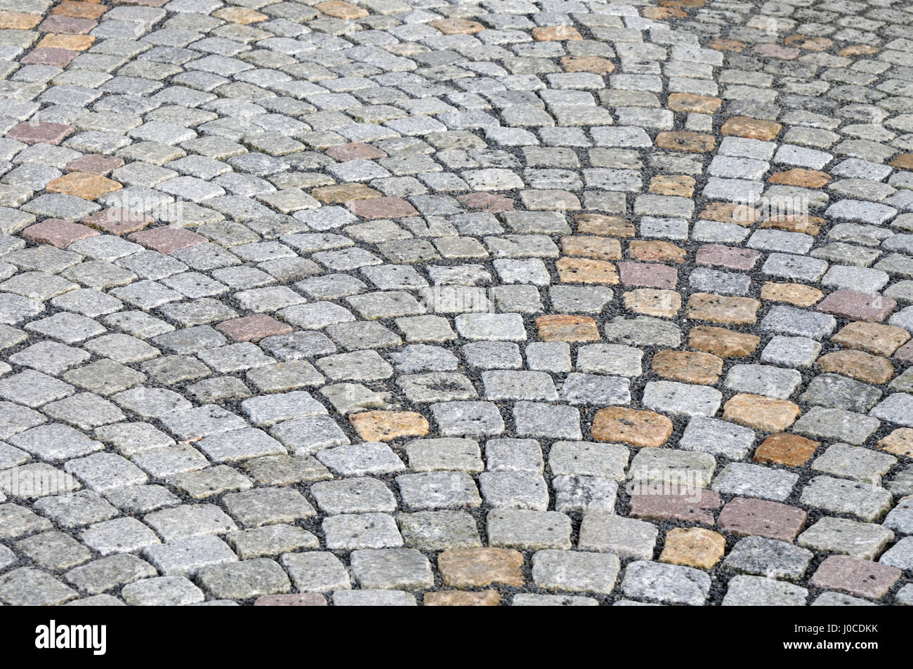 Granite cobbles laid in a curved pattern in a street in Bergen. Bergen ...