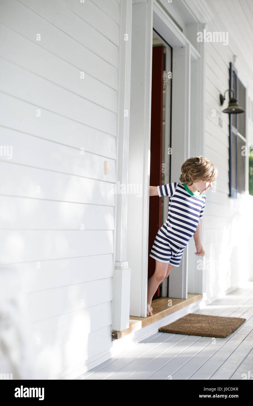 Boy leaning forward hi-res stock photography and images - Alamy