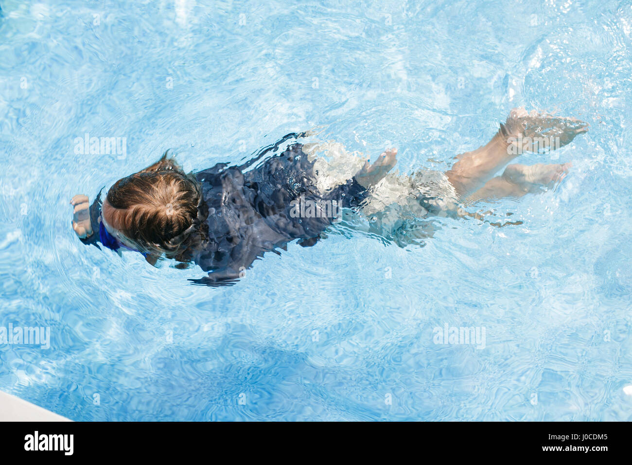 Overhead Person Swimming In Blue Water High Resolution Stock ...