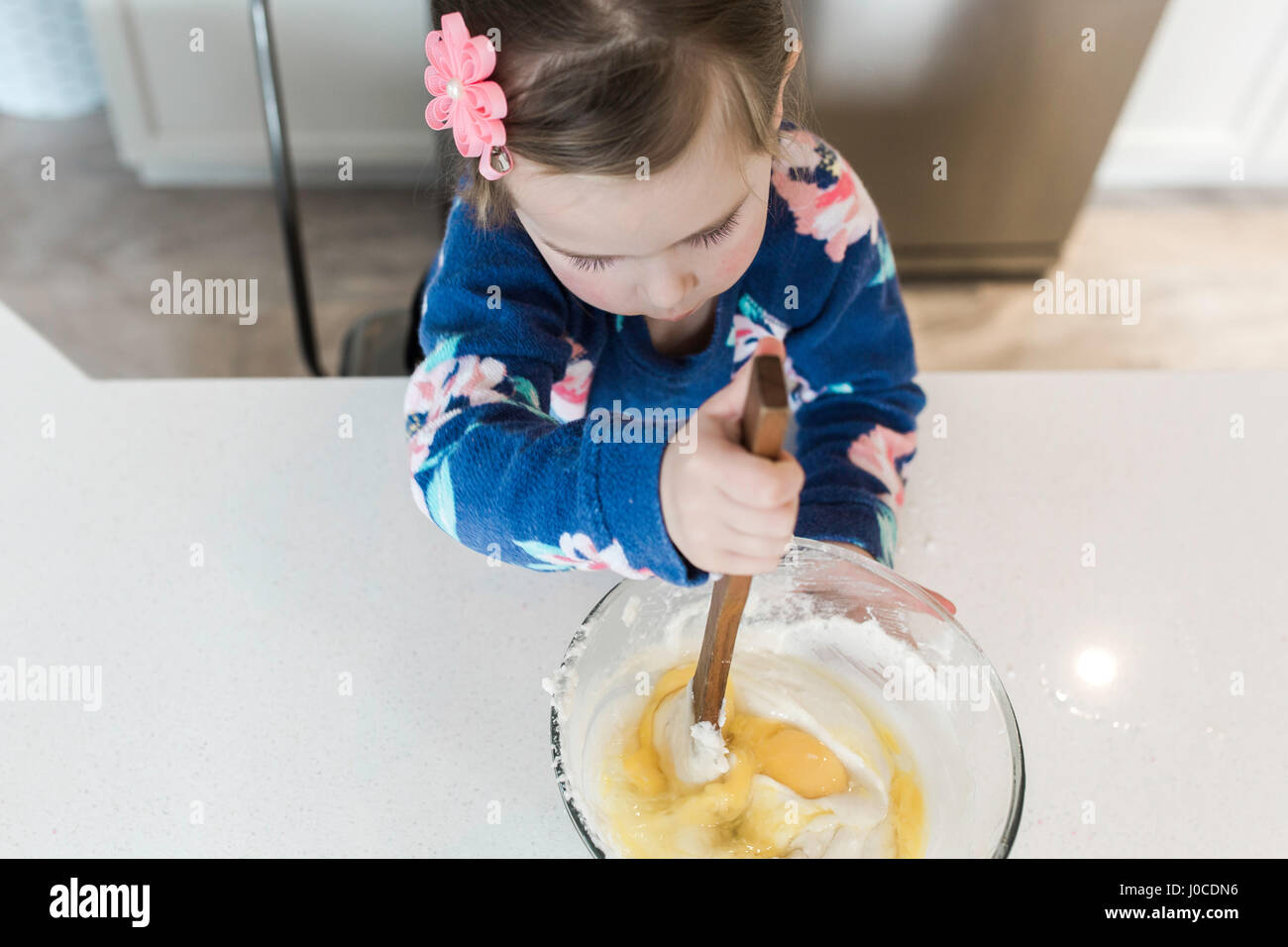 Child stirring wooden spoon hi-res stock photography and images - Alamy