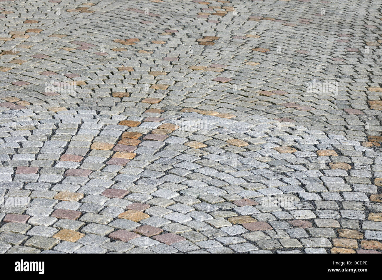 Granite cobbles laid in a curved pattern in a street in Bergen. Bergen ...