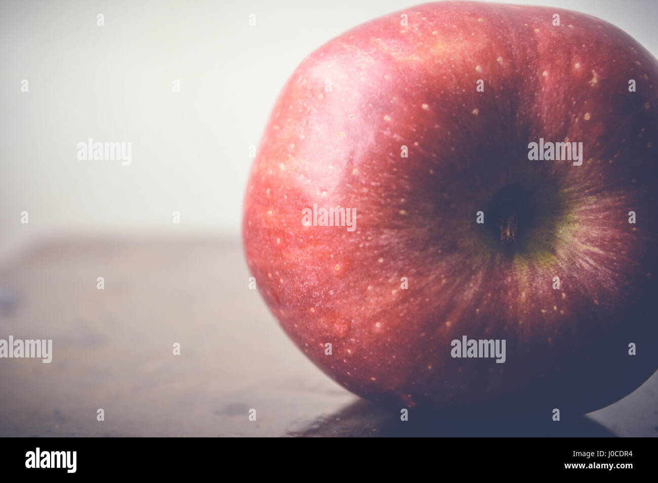 apple on wooden table Stock Photo - Alamy