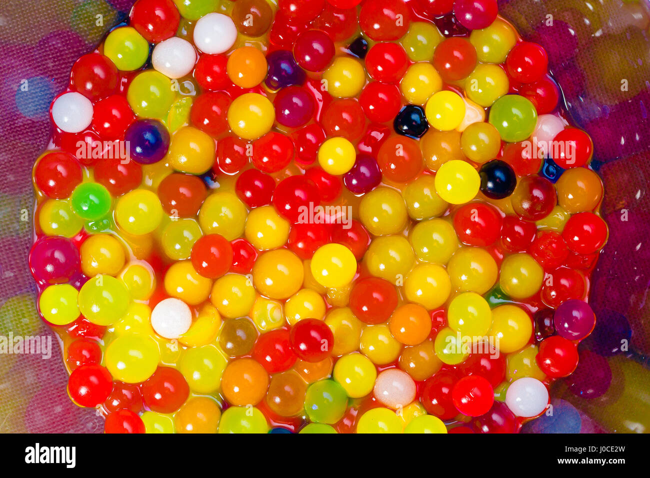 magic growing jelly balls, colorful abstract background Stock Photo - Alamy