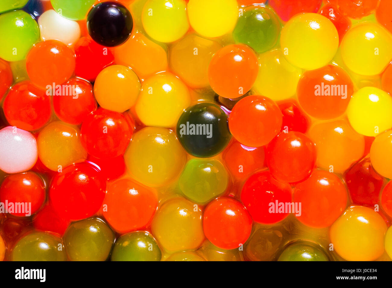 magic growing jelly balls, colorful abstract background Stock Photo - Alamy