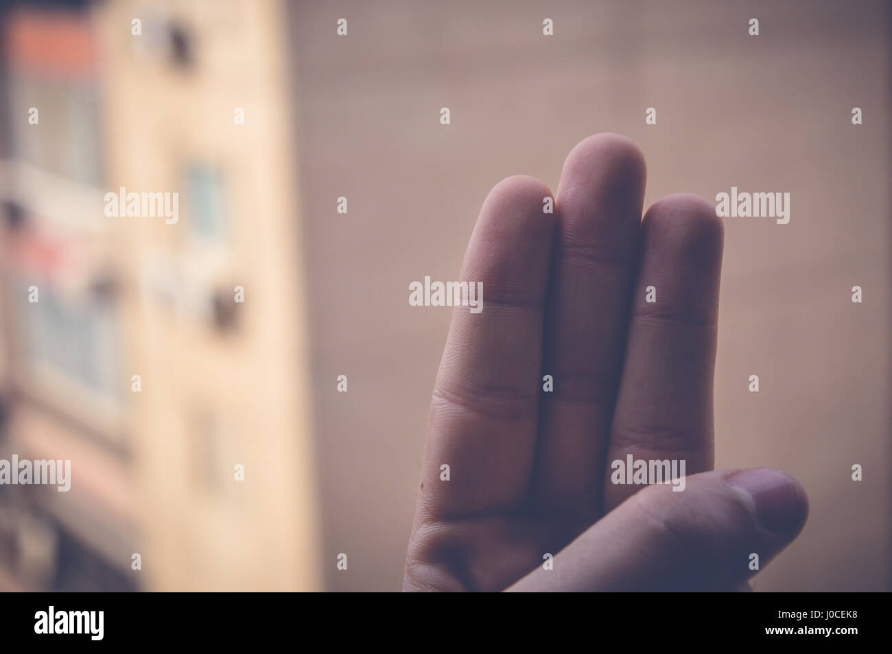 three fingers hand sign Stock Photo - Alamy