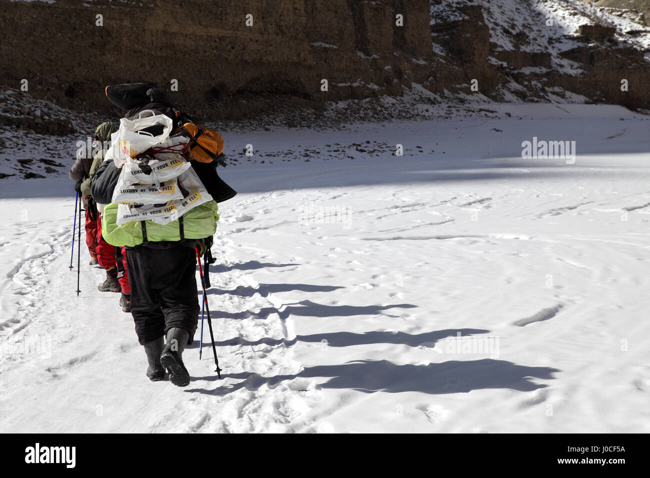 People carrying luggage, chadar trek, ladakh, jammu and kashmir, india ...