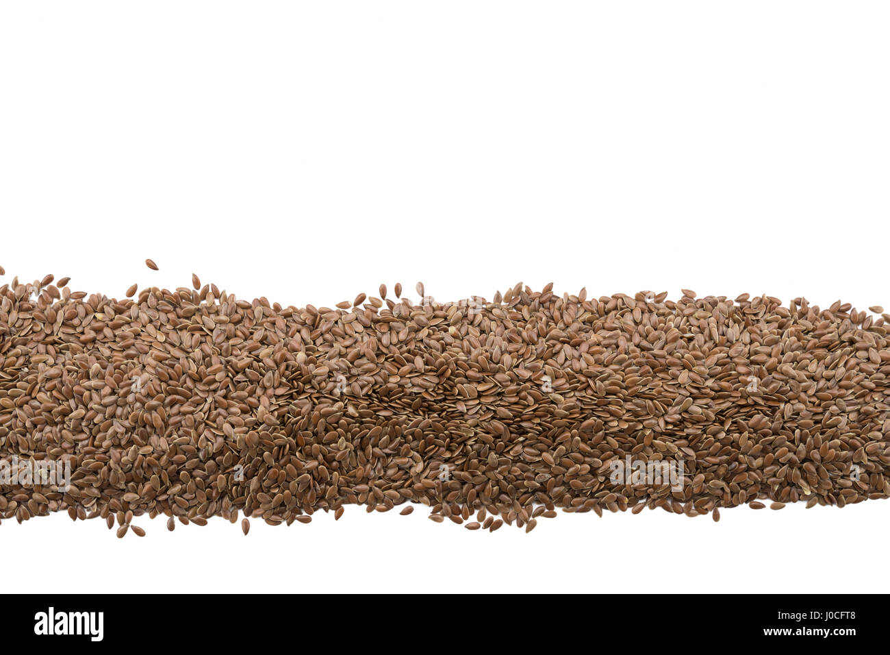 Flax Seeds in Row on Isolated White Background Stock Photo - Alamy