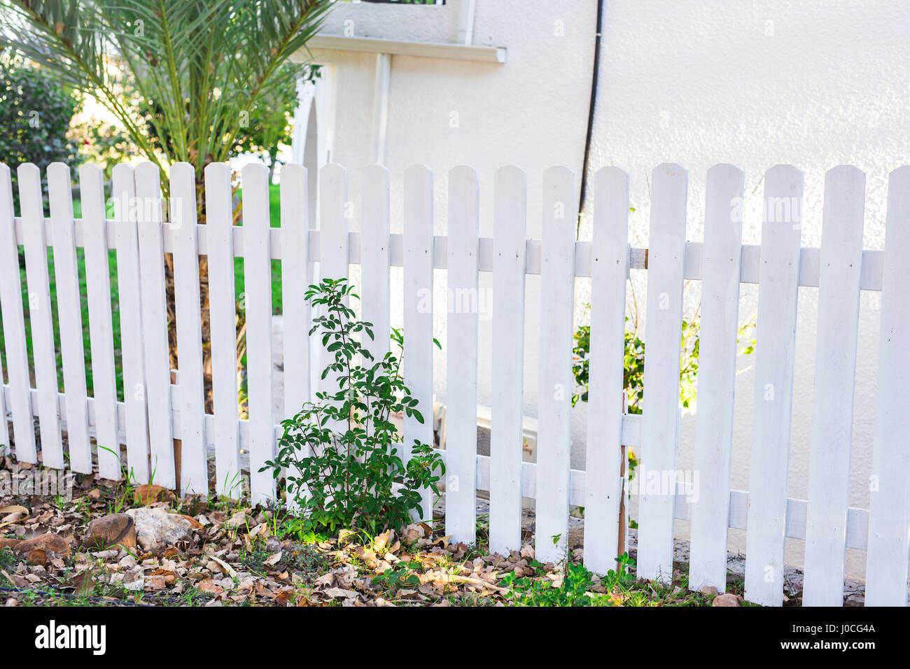 White fence in perspective Stock Photo - Alamy