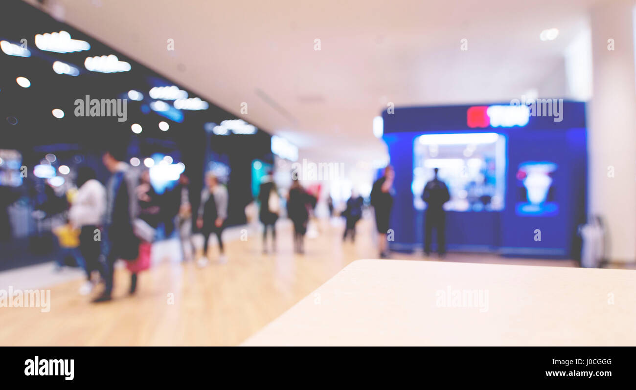 Blurred abstract background of the shopping center with people buying ...