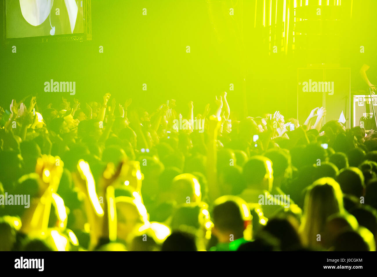 Crowd at concert and blurred stage lights . Close up of photographing ...
