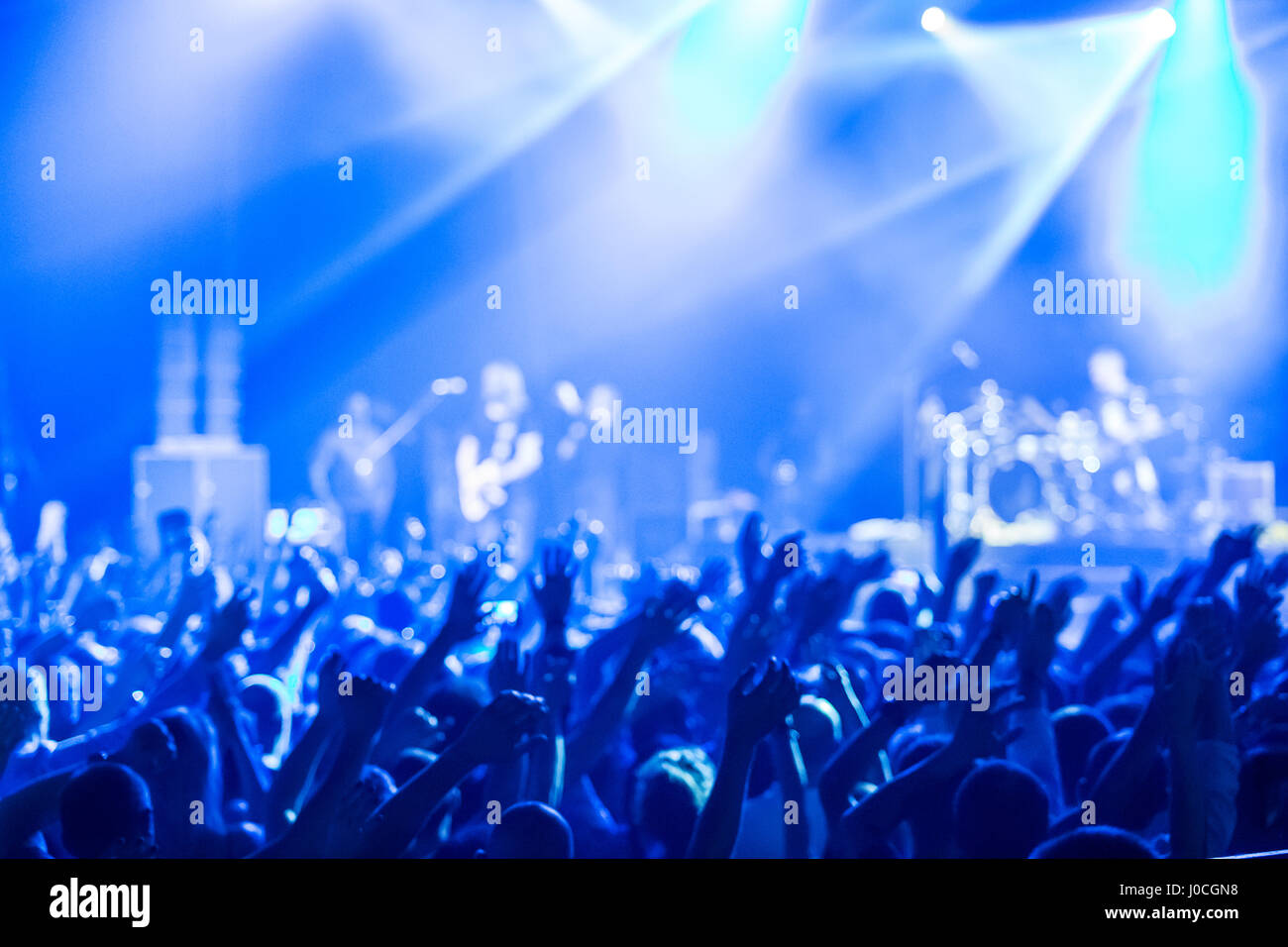 Crowd at concert and blurred stage lights . Close up of photographing ...