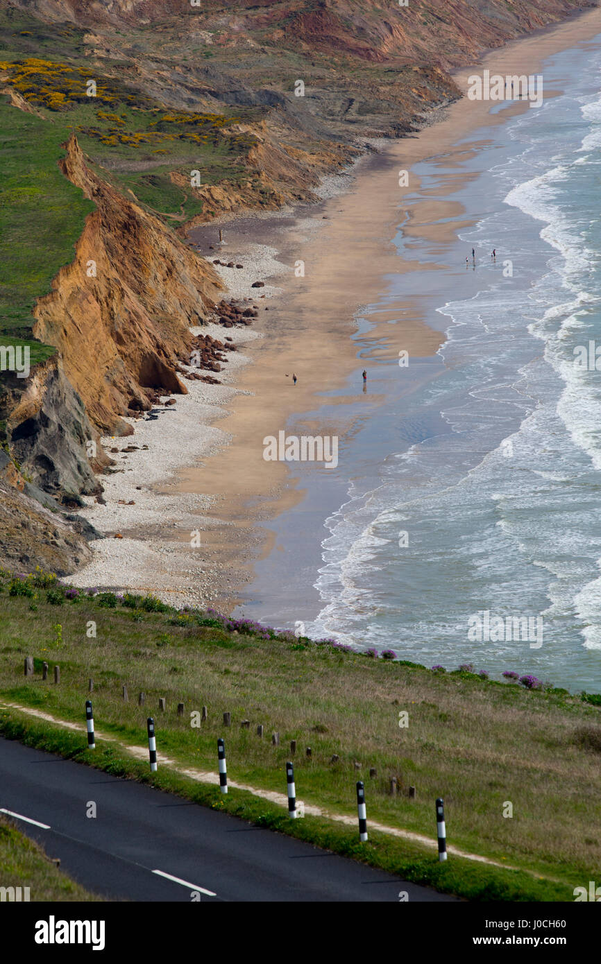Walkers on Compton Beach Isle of Wight England UK Stock Photo - Alamy