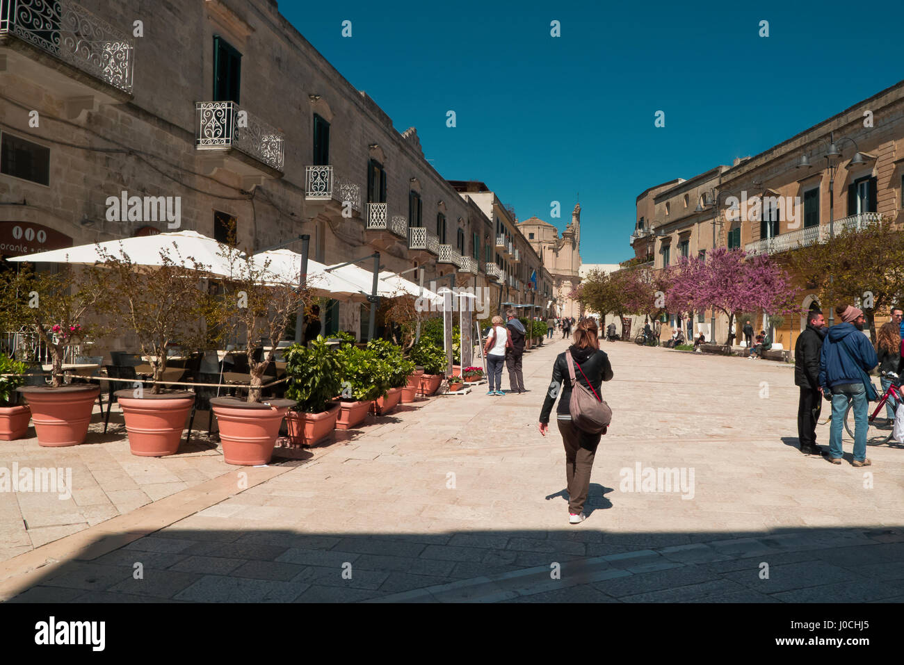 People a spring morning around in a city of south Italy Stock Photo - Alamy