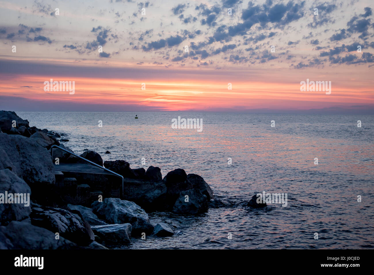 sunset in Trieste harbor Stock Photo - Alamy