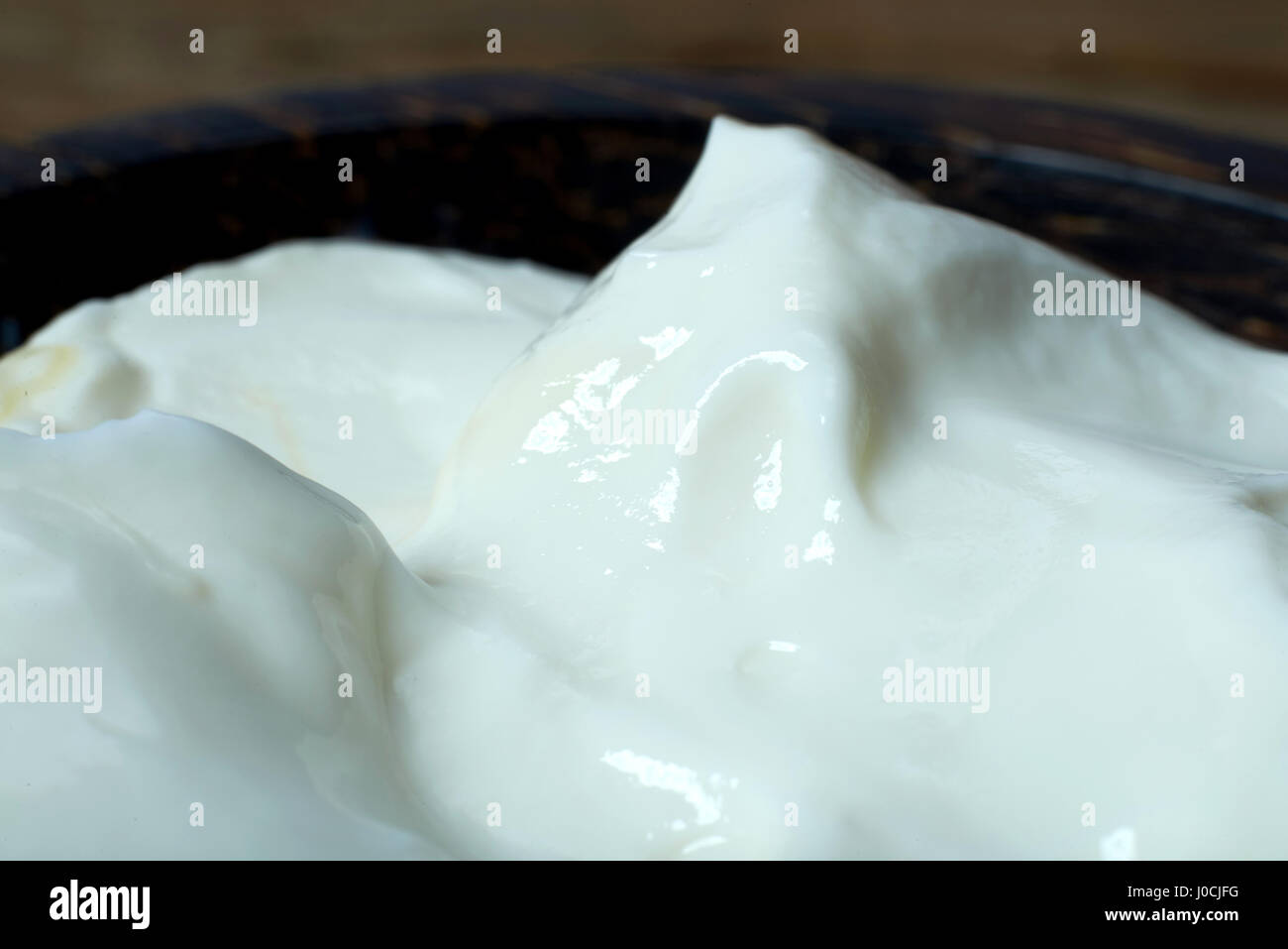 Closeup view of yogurt in a bowl Stock Photo - Alamy