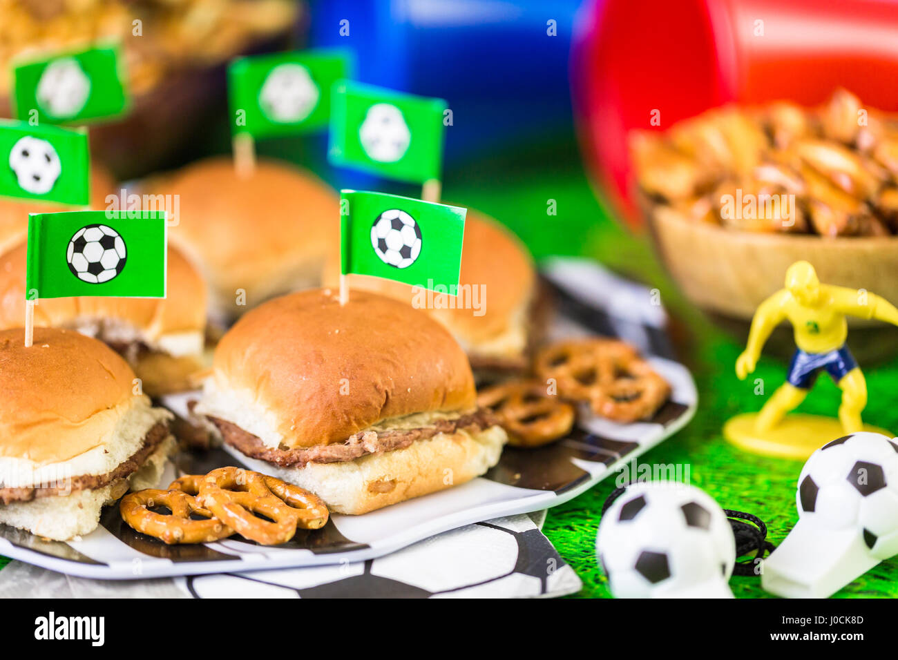 Salty snacks and beer on the table for soccer party Stock Photo - Alamy