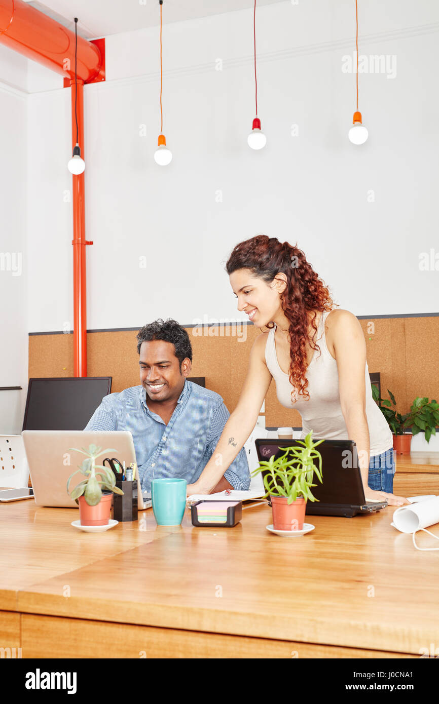 Computer training seminar in coworking space as business team Stock ...