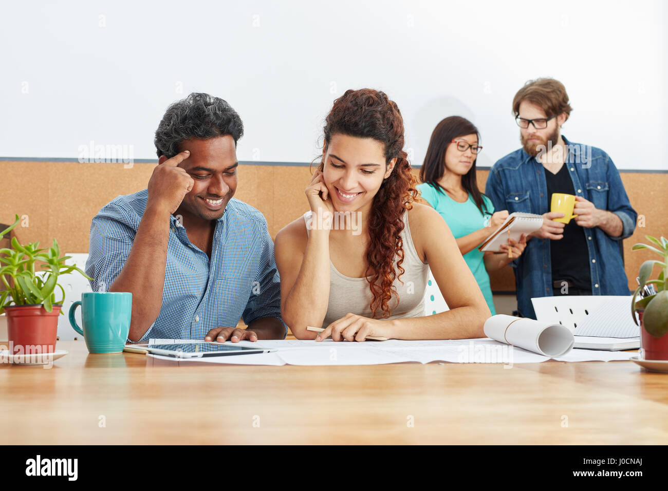 Young people brainstorming in teamwork for analysis of ideas concepts ...