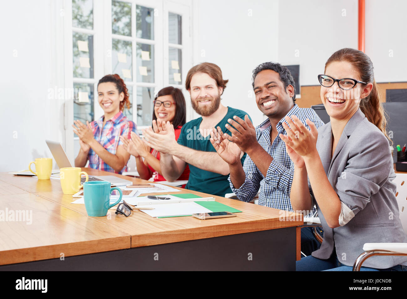Applause of business startup people in the office as team Stock Photo ...