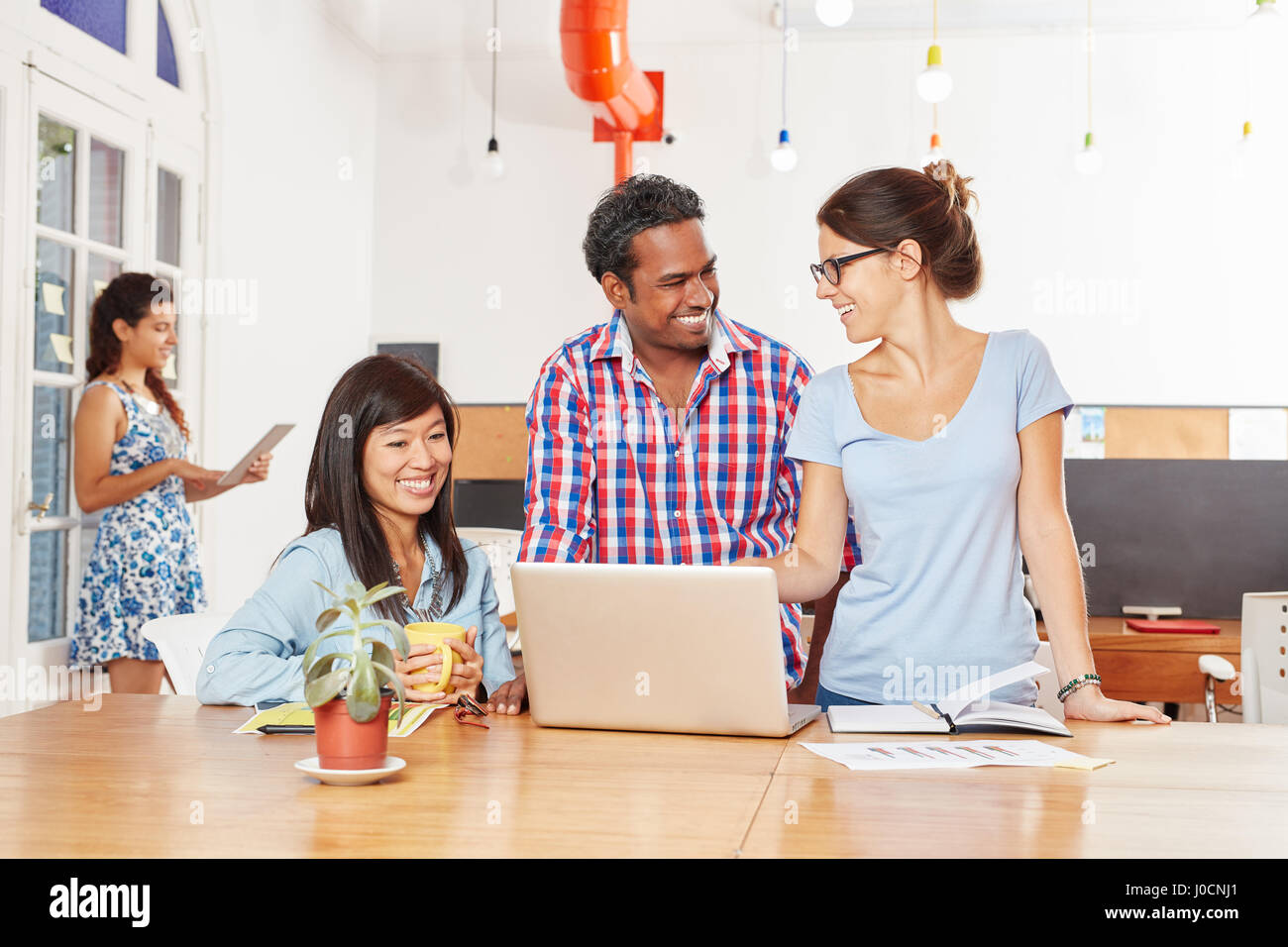 Startup team with computer in business workshop learn about cooperation ...