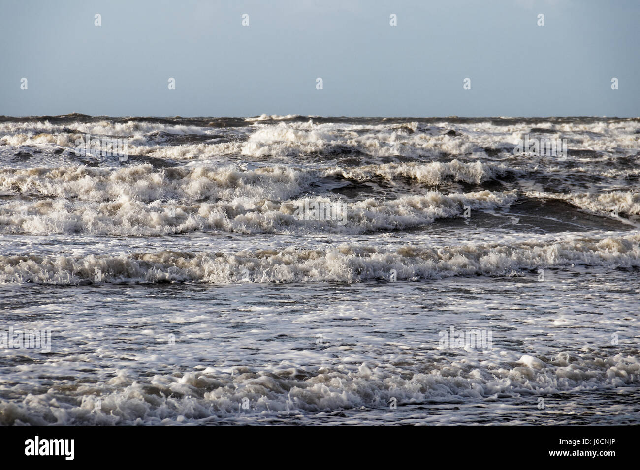 Waves breaking on the beach Stock Photo - Alamy