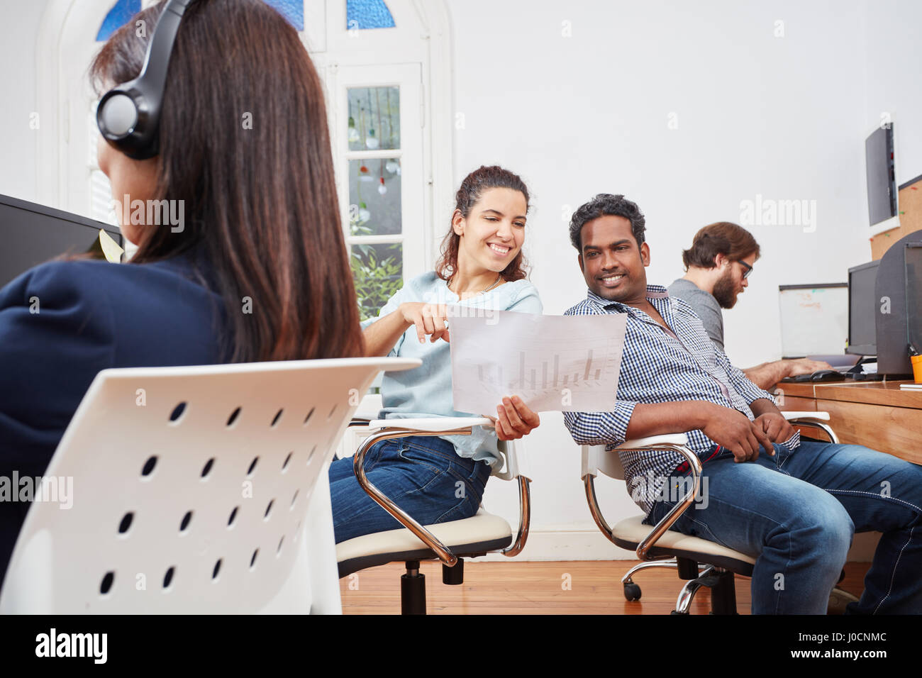 Collegues in customer service call center as consultants Stock Photo ...