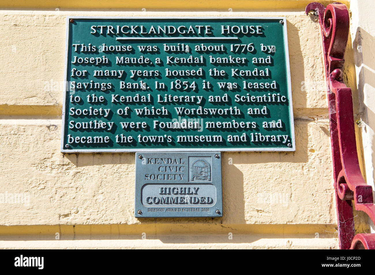 A plaque in the historic town of Kendal in the UK, marking the location ...