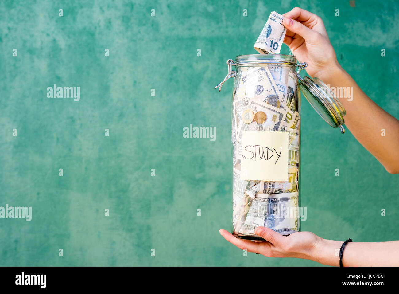 Money for study hi-res stock photography and images - Alamy