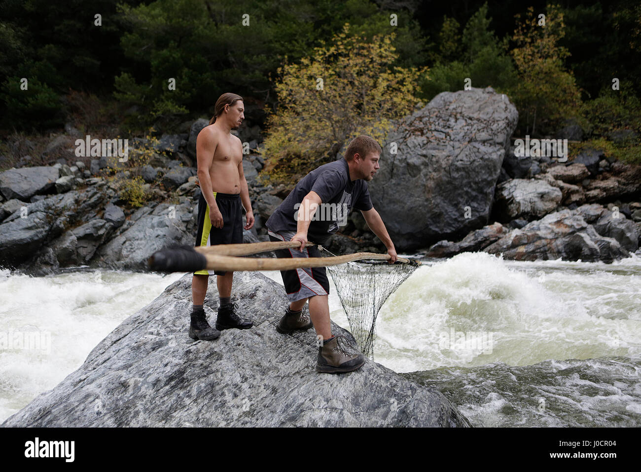 Jerry Brink (left) and J.J. Reed, of the Karuk Indian Tribe, use a dip ...