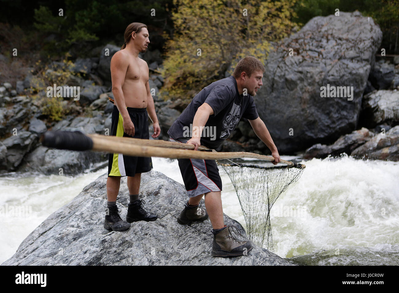 Jerry Brink (left) and J.J. Reed, of the Karuk Indian Tribe, use a dip ...