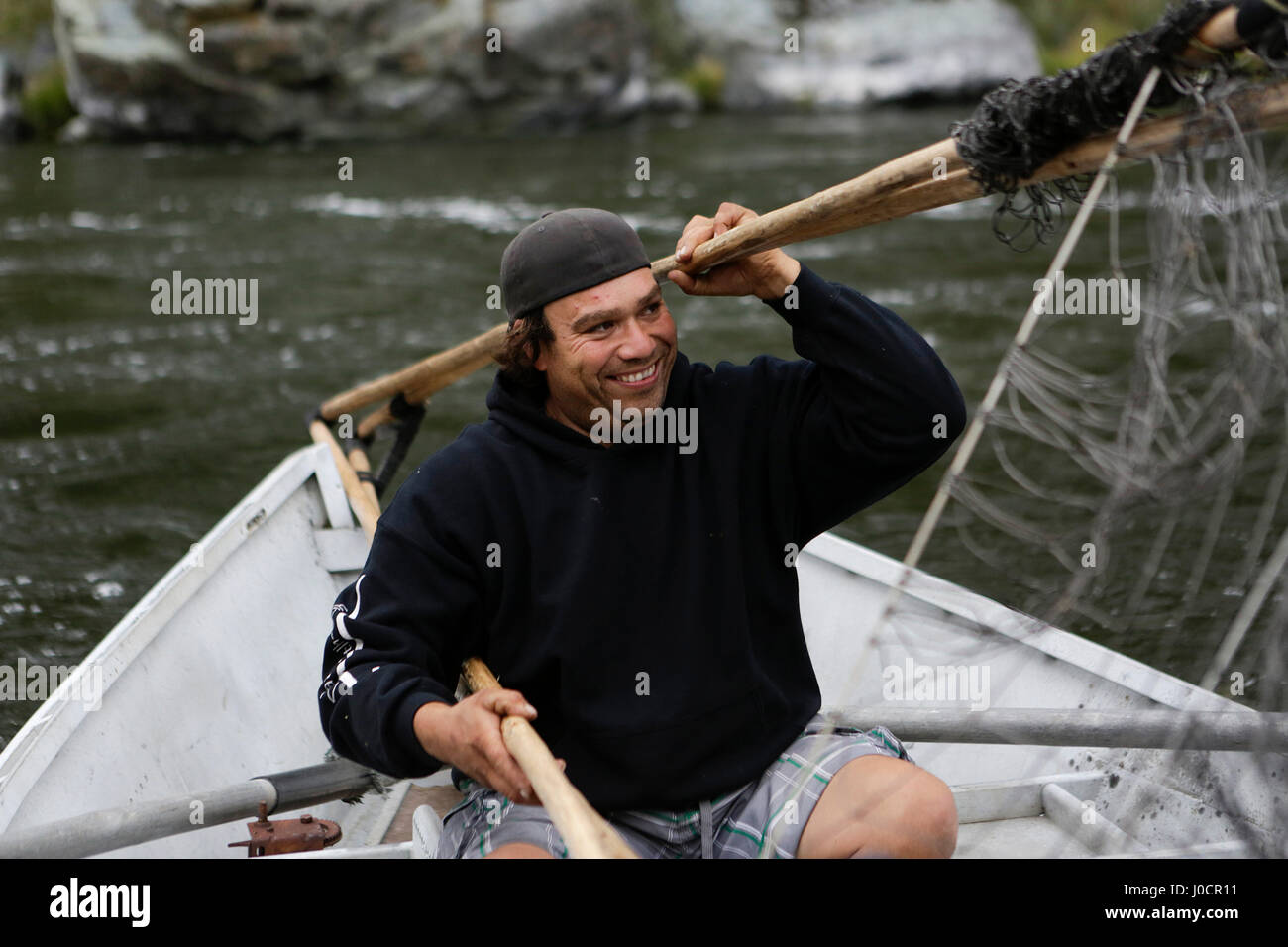 Ken Brink of the Karuk Indian Tribe uses a dip net to fish for king ...