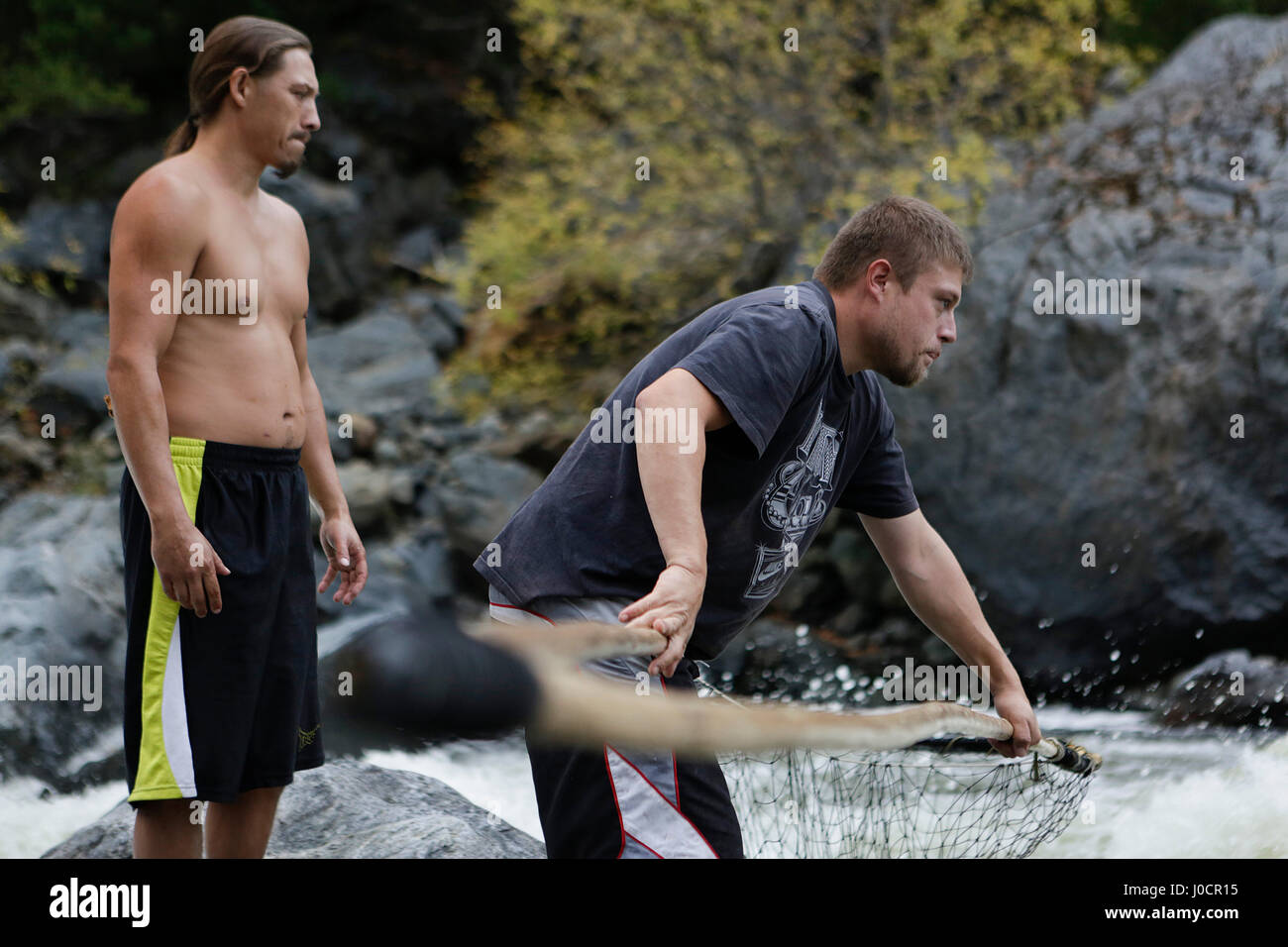 Jerry Brink (left) and J.J. Reed, of the Karuk Indian Tribe, use a dip ...
