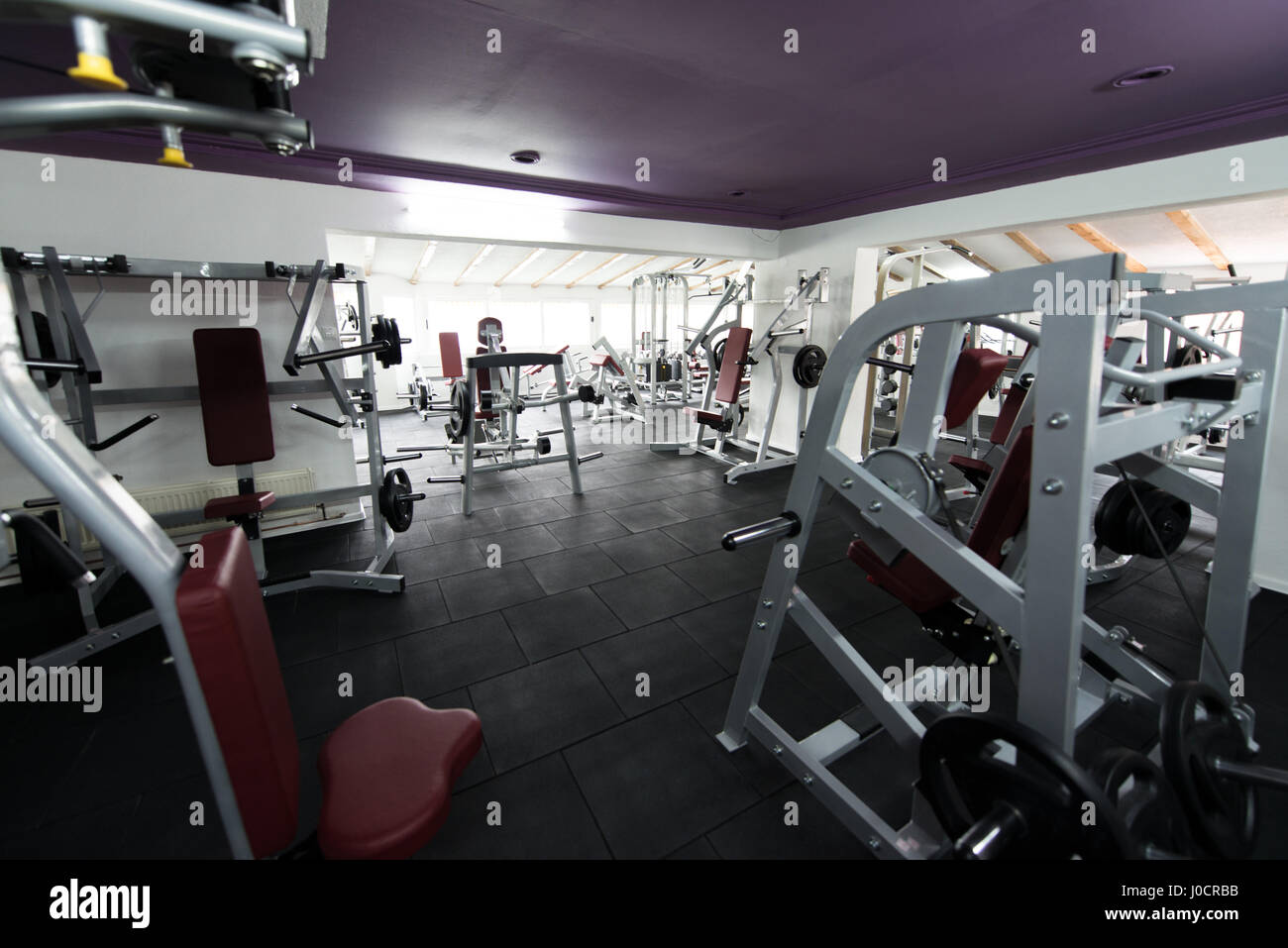 Modern Gym Room Fitness Center With Equipment And Machines Stock Photo ...